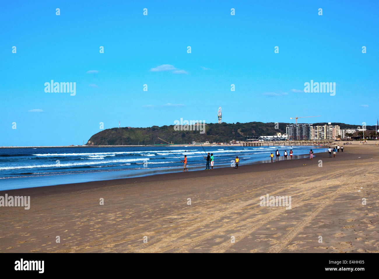 DURBAN, SOUTH AFRICA - JUNE 16, 2014: Many unknown people fish and walk ...