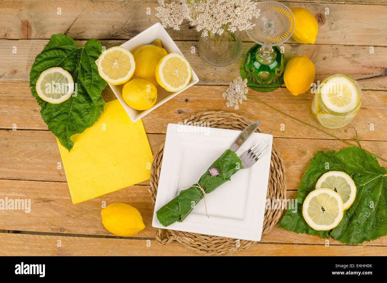 Still life of a rustic table set up in summery colors Stock Photo - Alamy