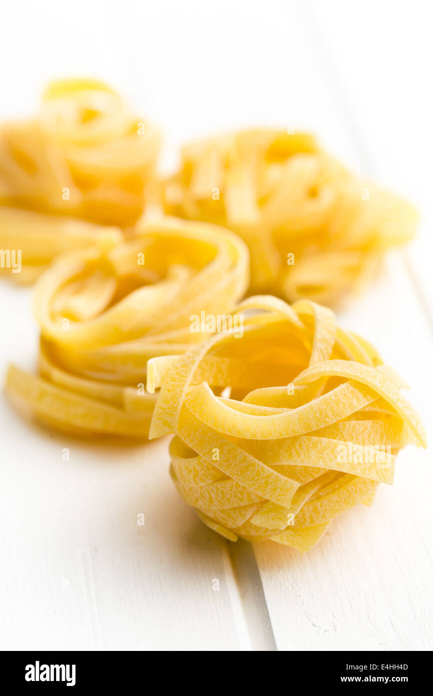 Italian pasta tagliatelle on white table Stock Photo - Alamy