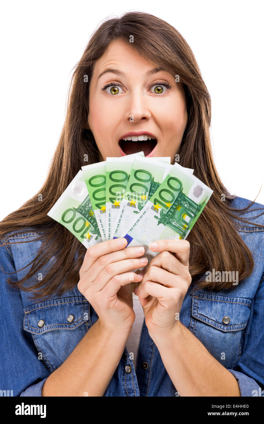 Beautiful woman holding some Euro currency notes, isolated over white ...