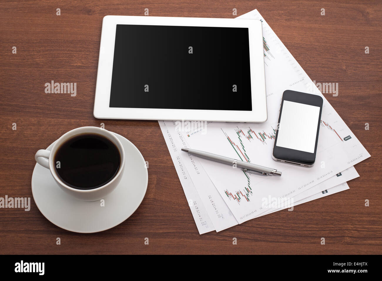 Digital tablet on wooden tablets with mobile and coffee Stock Photo - Alamy