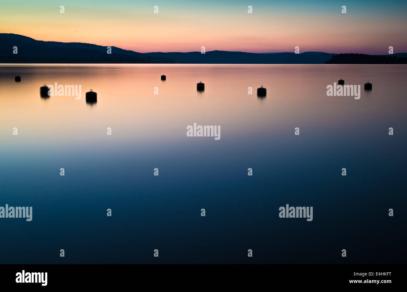 Morning on the shore of a mountain lake. Sunrise Stock Photo - Alamy
