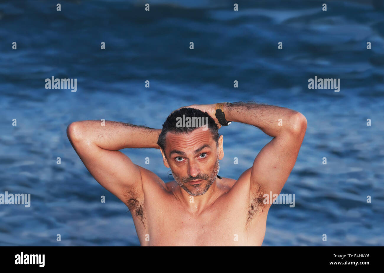 male swimmer and blue sea background Stock Photo - Alamy