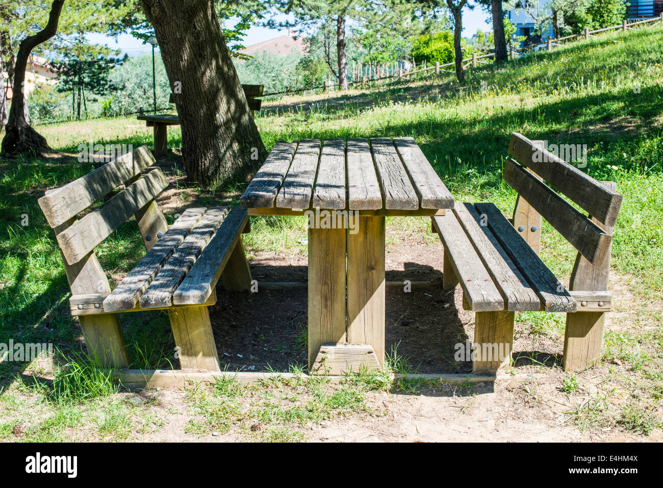 Wooden benches and a table in the woods Stock Photo - Alamy