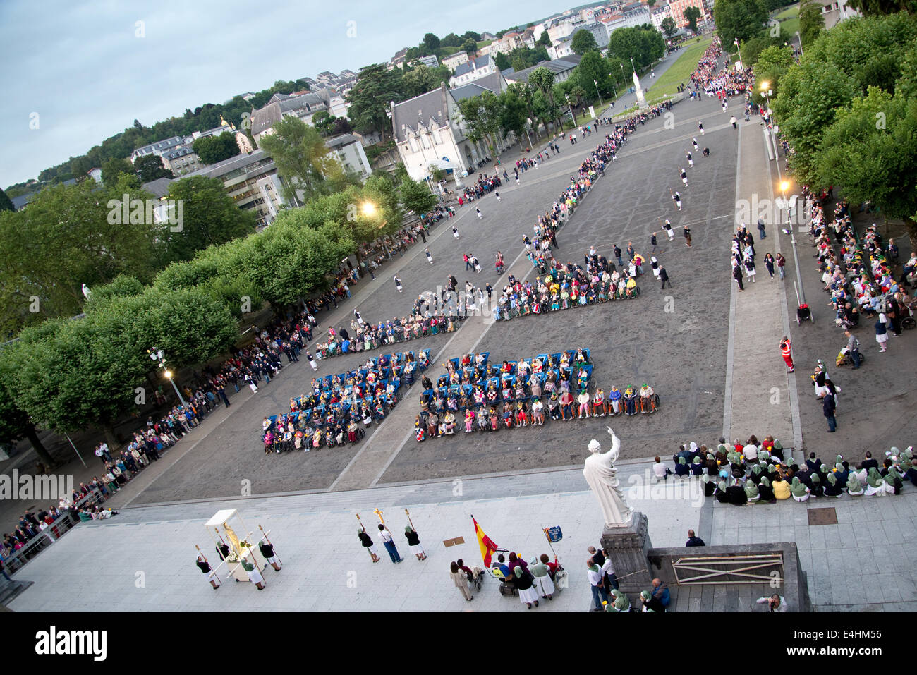 people are praying in Lourdes Stock Photo - Alamy