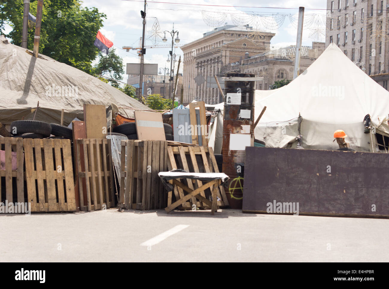 Barricade across a town street with wooden palettes and an entrance ...