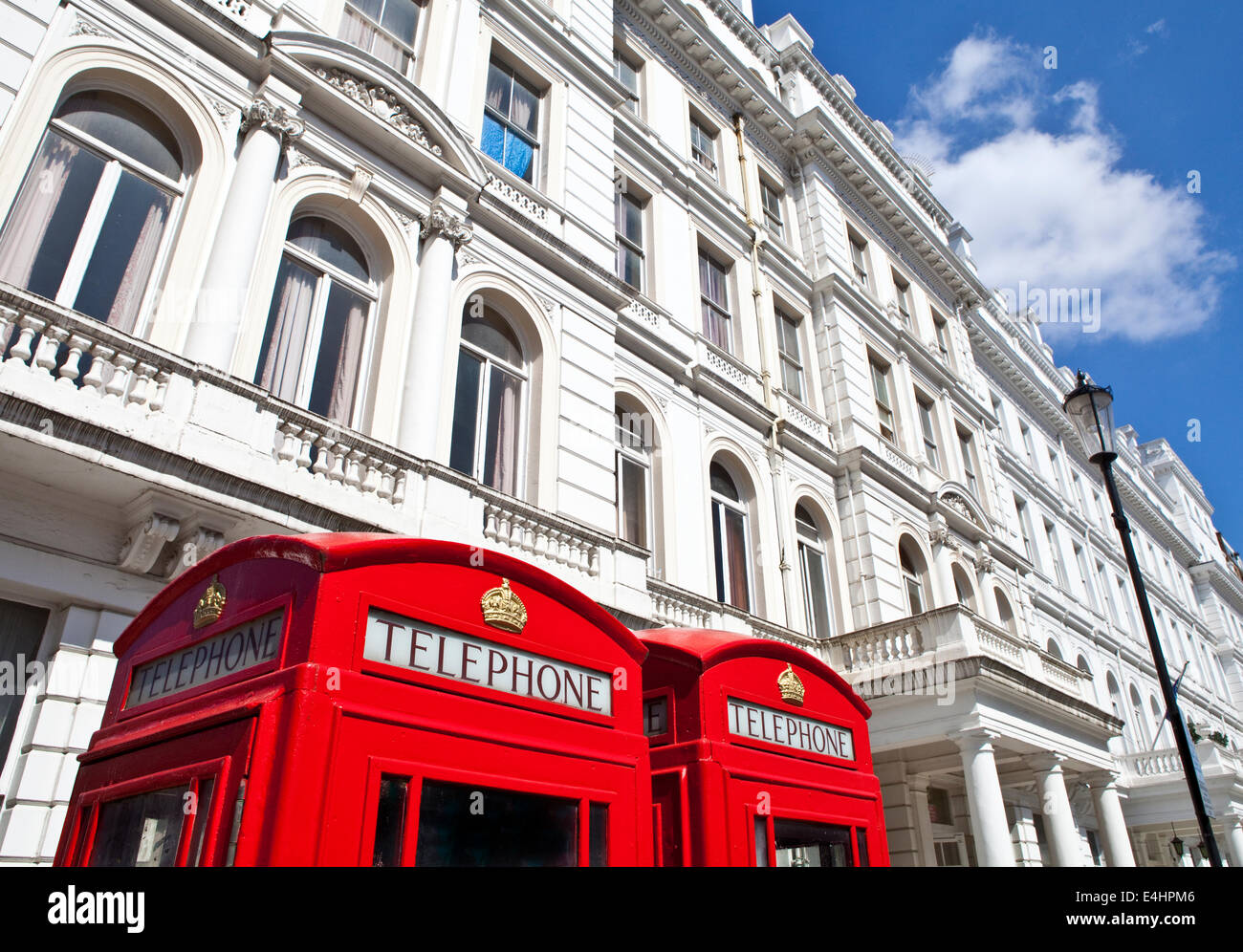 Iconic red Telephone Boxes outside attractive London appartments Stock ...