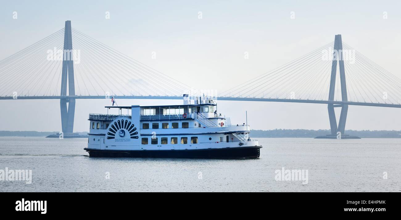 Tour Boat with Bridge Stock Photo - Alamy