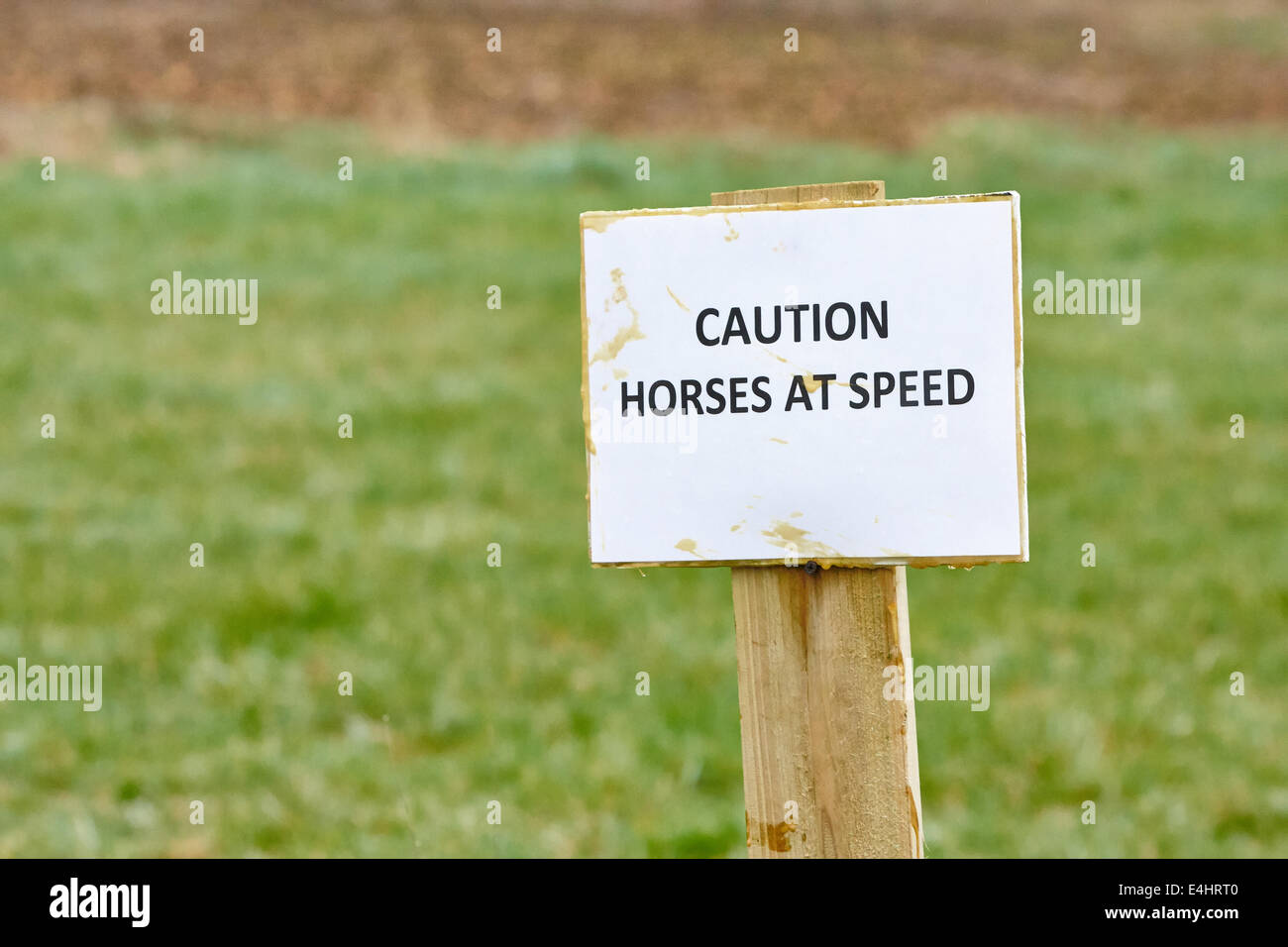 Sign reading Caution Horses at Speed Stock Photo - Alamy