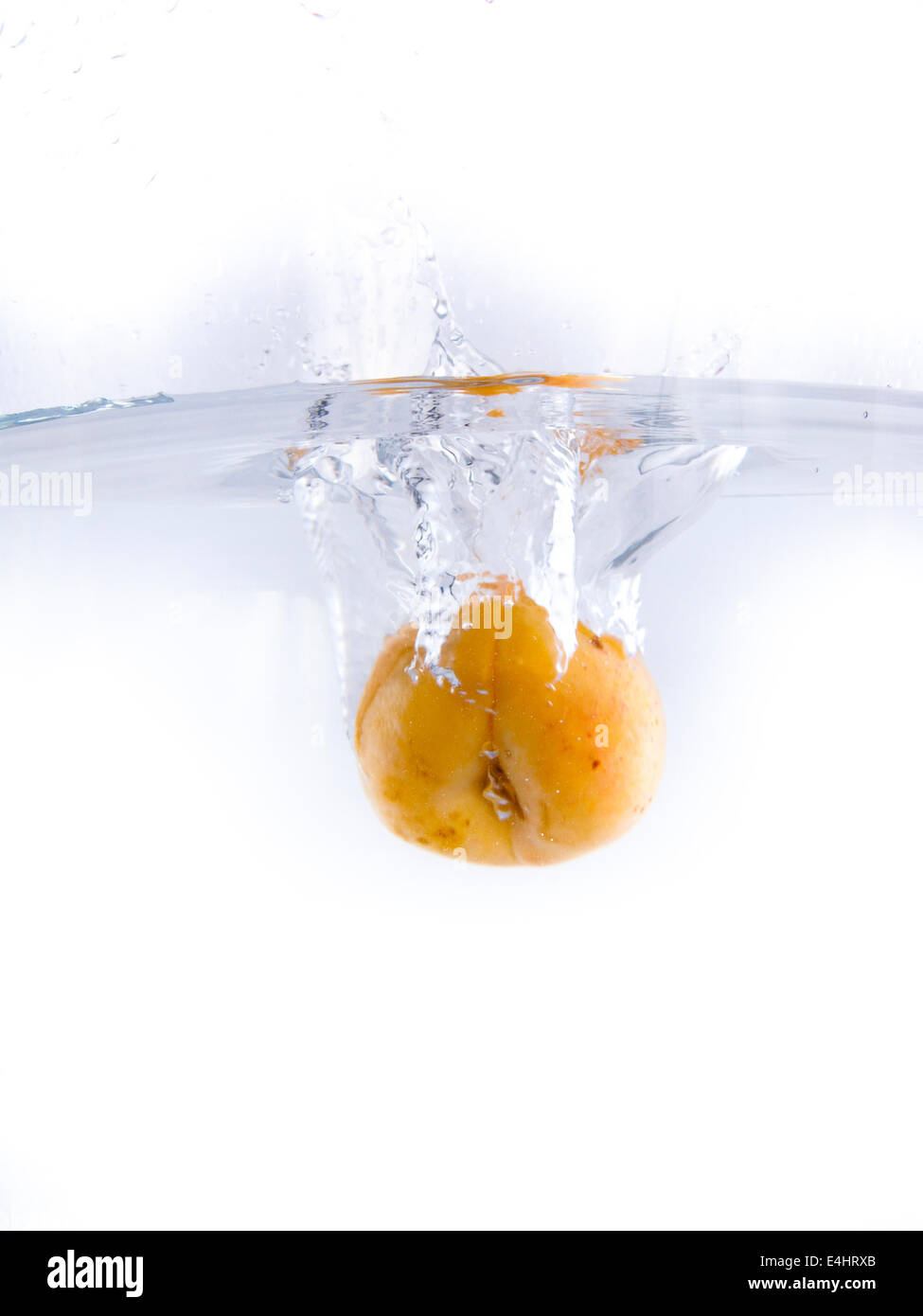 Fruits falling into the water Stock Photo - Alamy