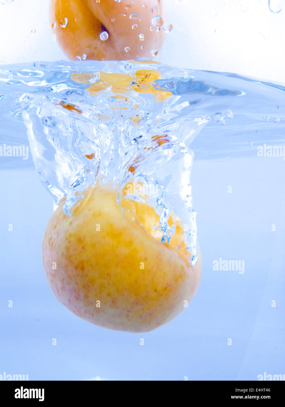 Fruits falling into the water Stock Photo - Alamy