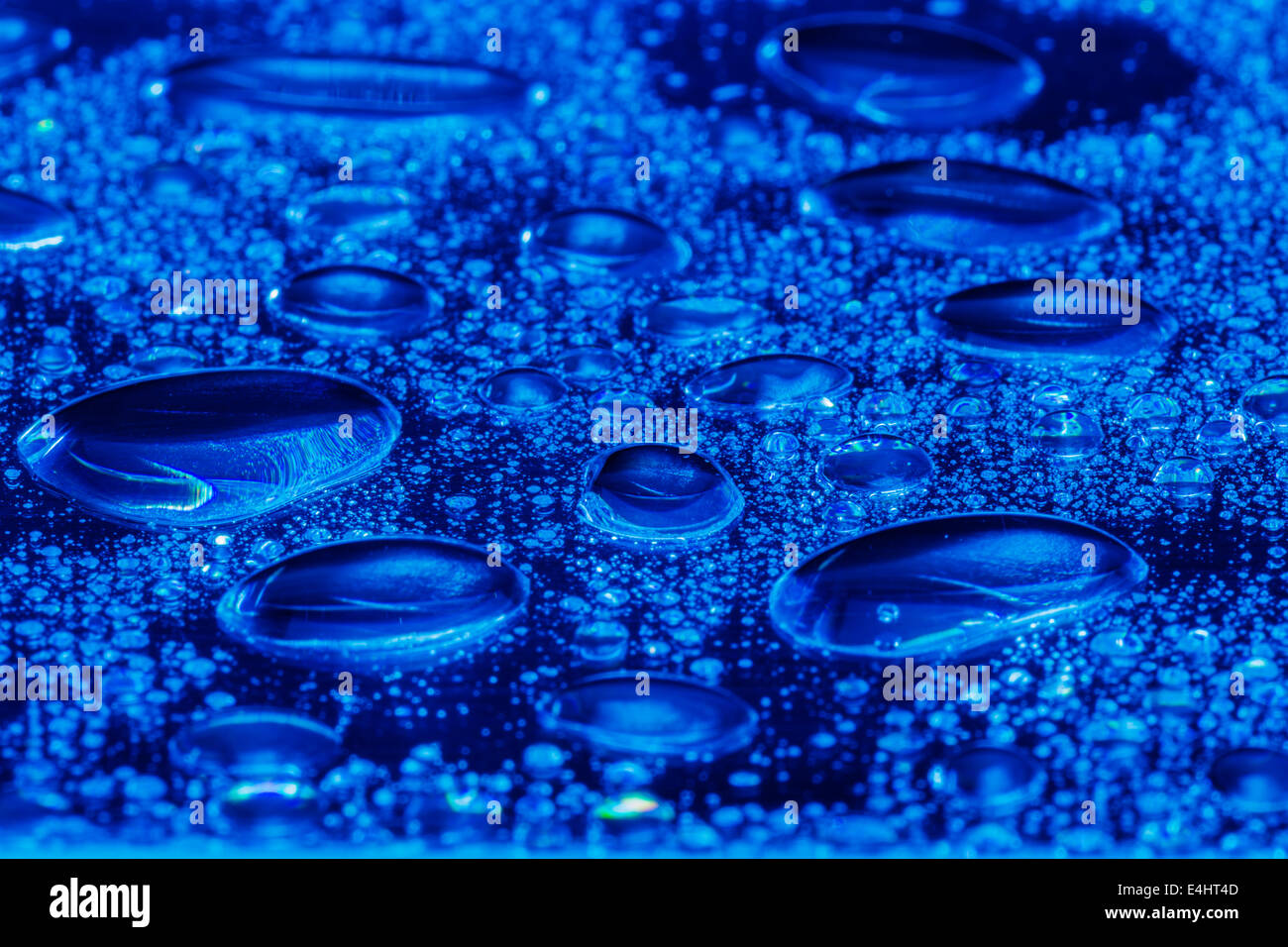 blue water drops on the surface Stock Photo - Alamy