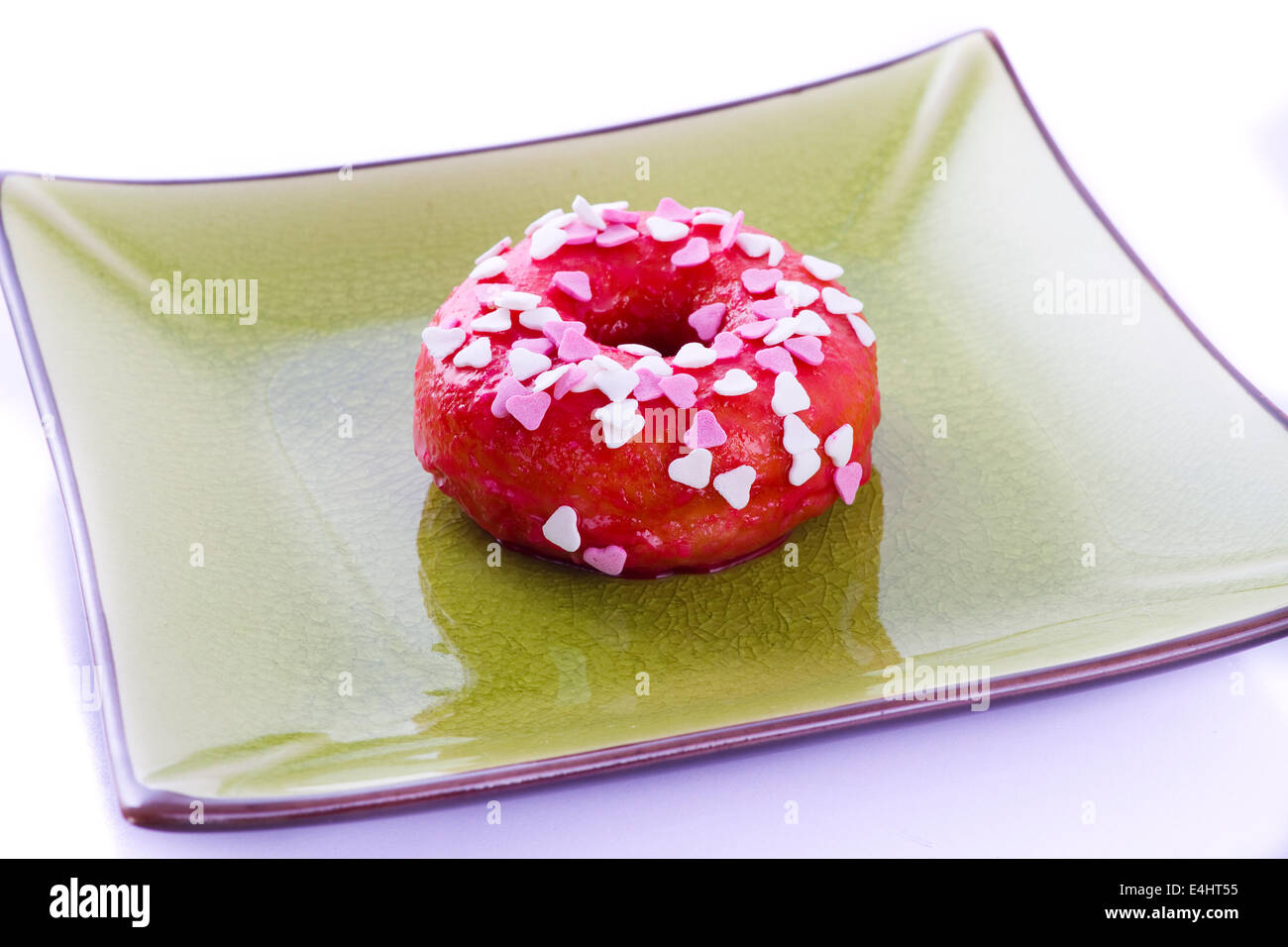 Colorful donut on a plate Stock Photo - Alamy