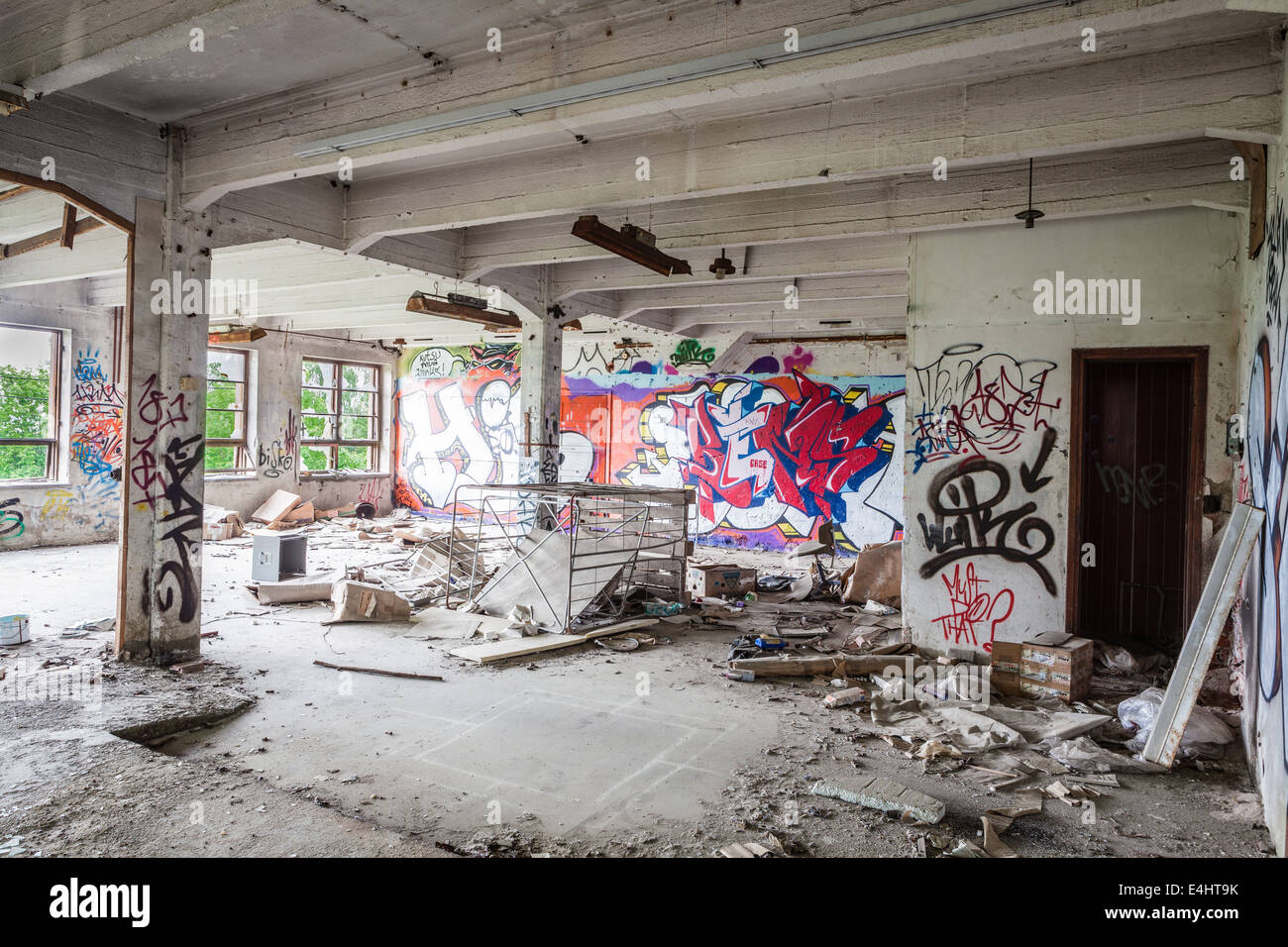 Messy abandoned factory room Stock Photo - Alamy