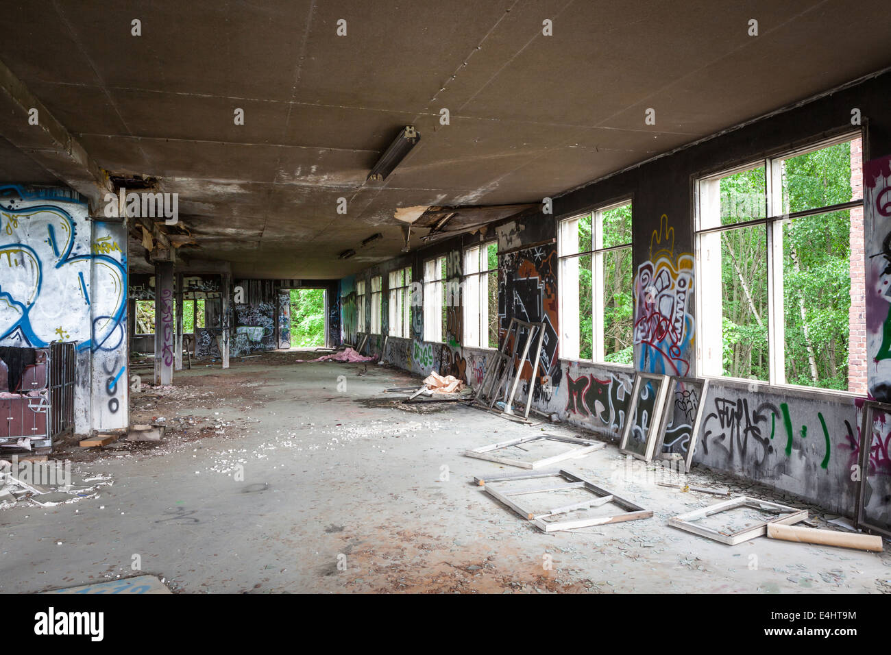 Messy abandoned factory room Stock Photo - Alamy