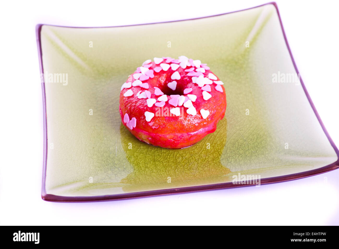 Colorful donut on a plate Stock Photo - Alamy