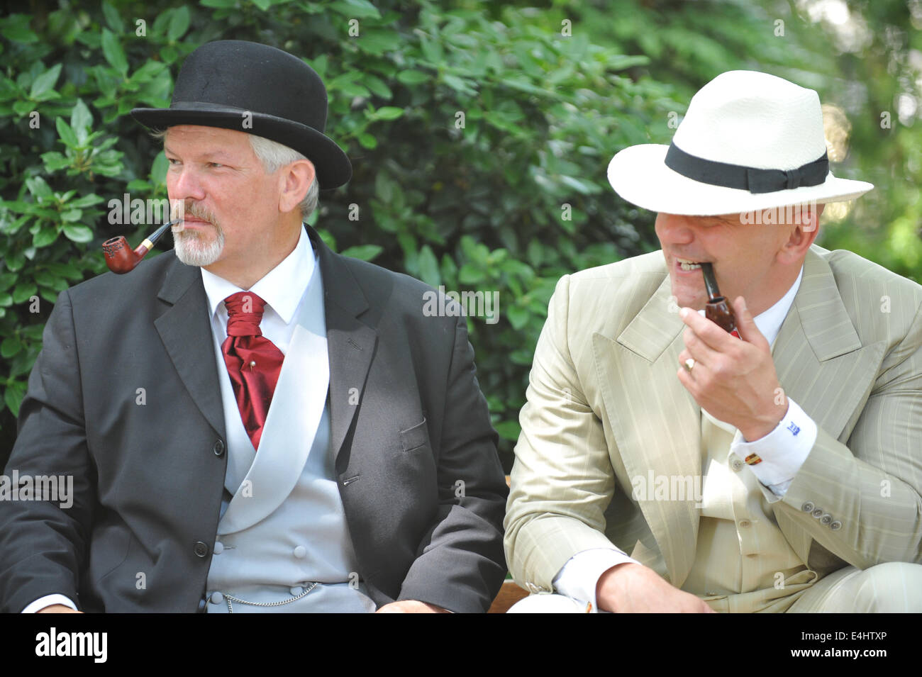 Bedford Square, London, UK. 12th July 2014. Two 'chaps' smoking pipes ...
