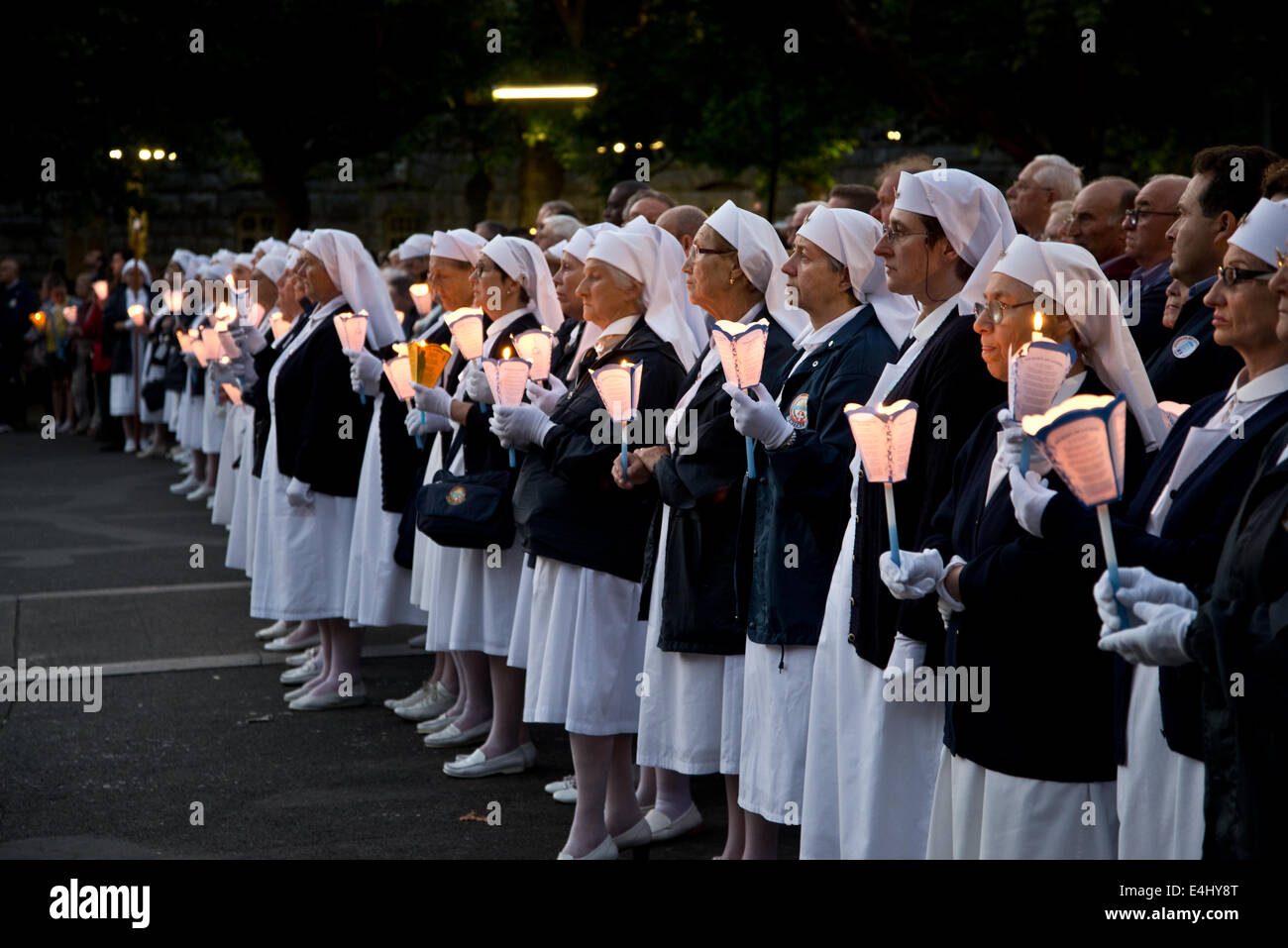 people are praying in Lourdes Stock Photo - Alamy