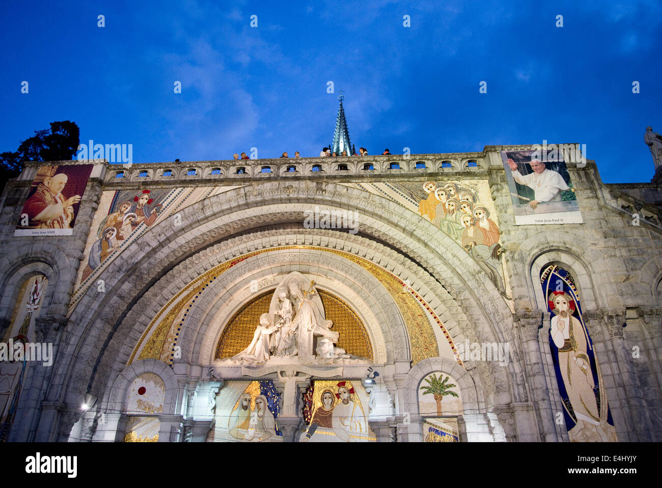 people are praying in Lourdes Stock Photo - Alamy