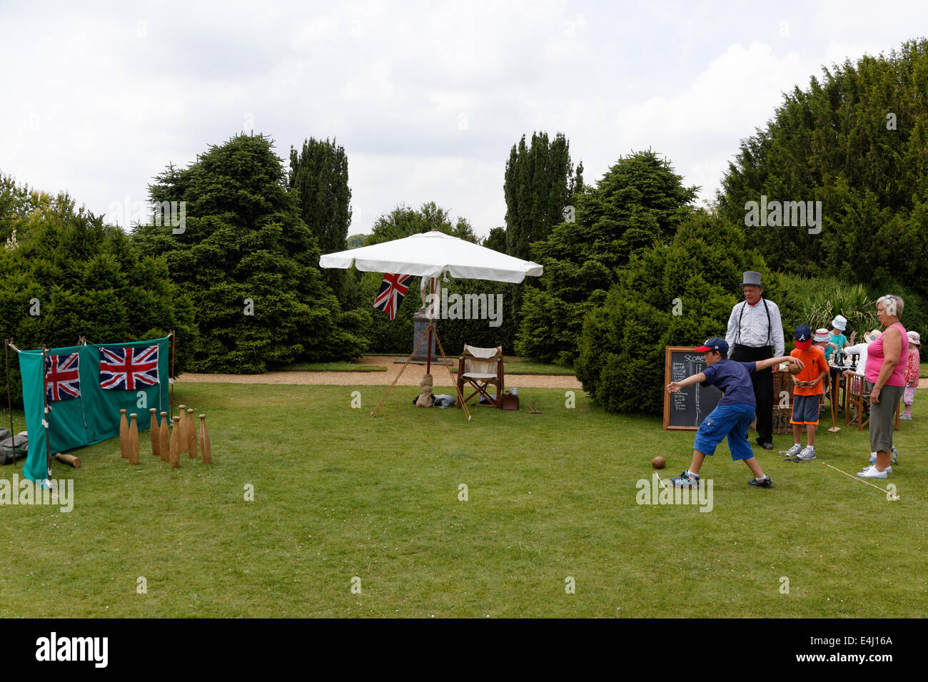 A boy prepares to throw a skittle ball during a game on the South Lawn ...