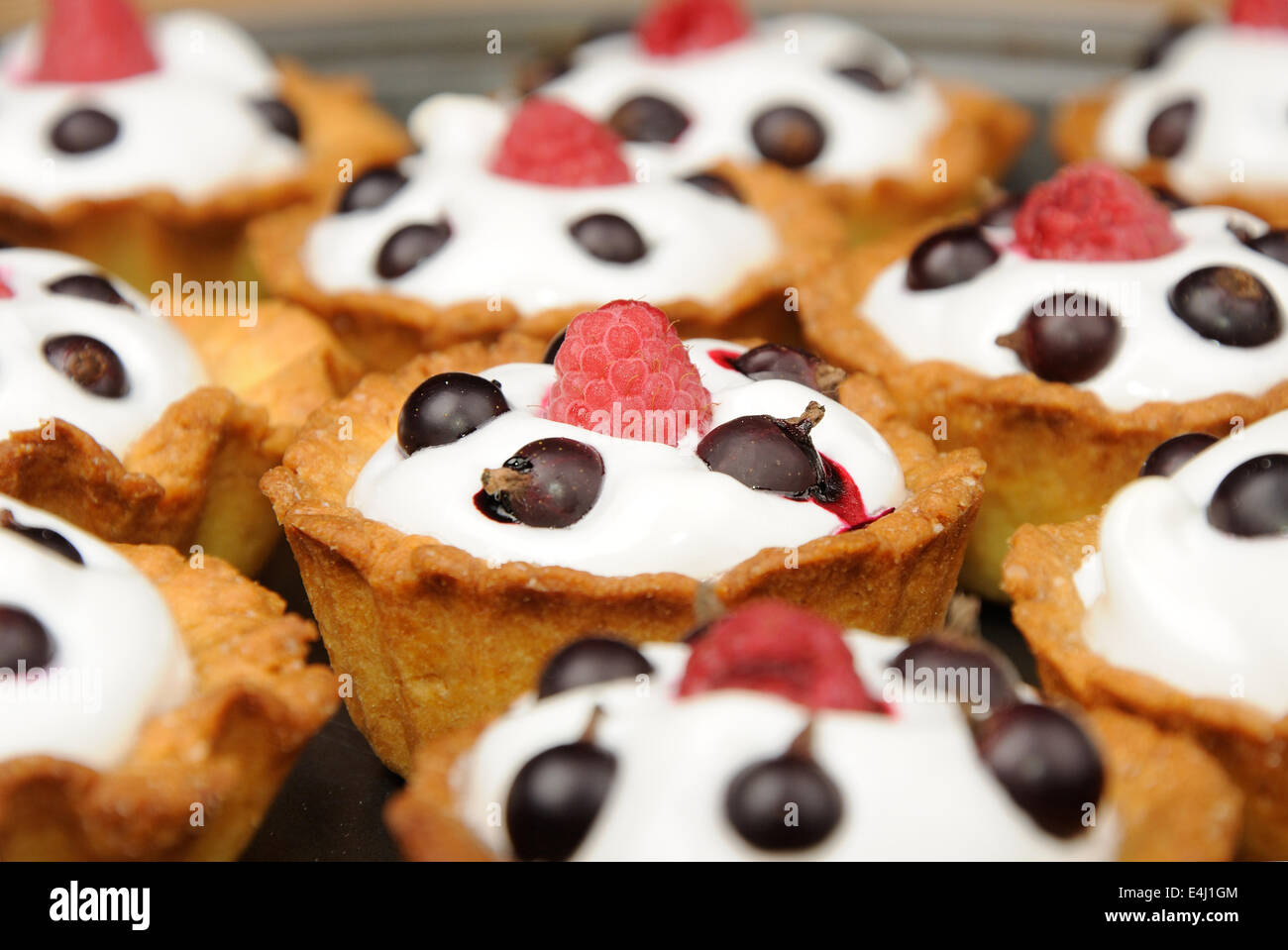 biscuit with cream, raspberry and currant between many others Stock ...
