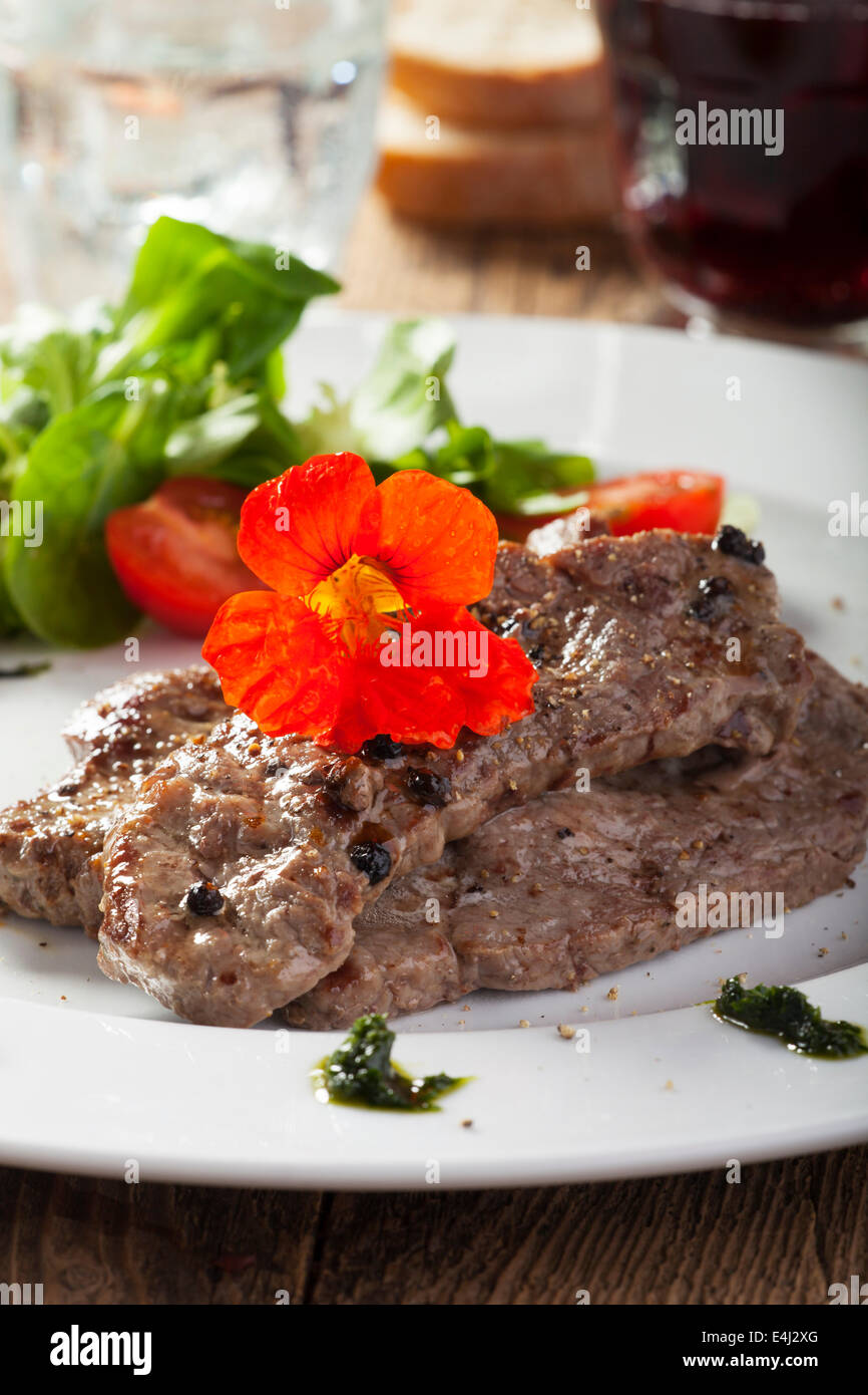grilled steak with indian cress flower Stock Photo - Alamy