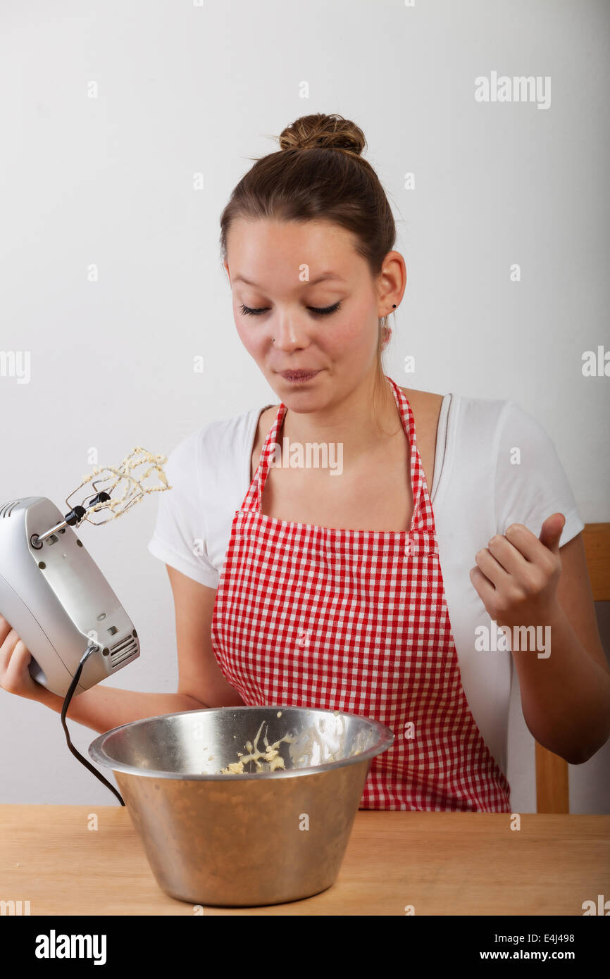 young woman baking a cake Stock Photo - Alamy