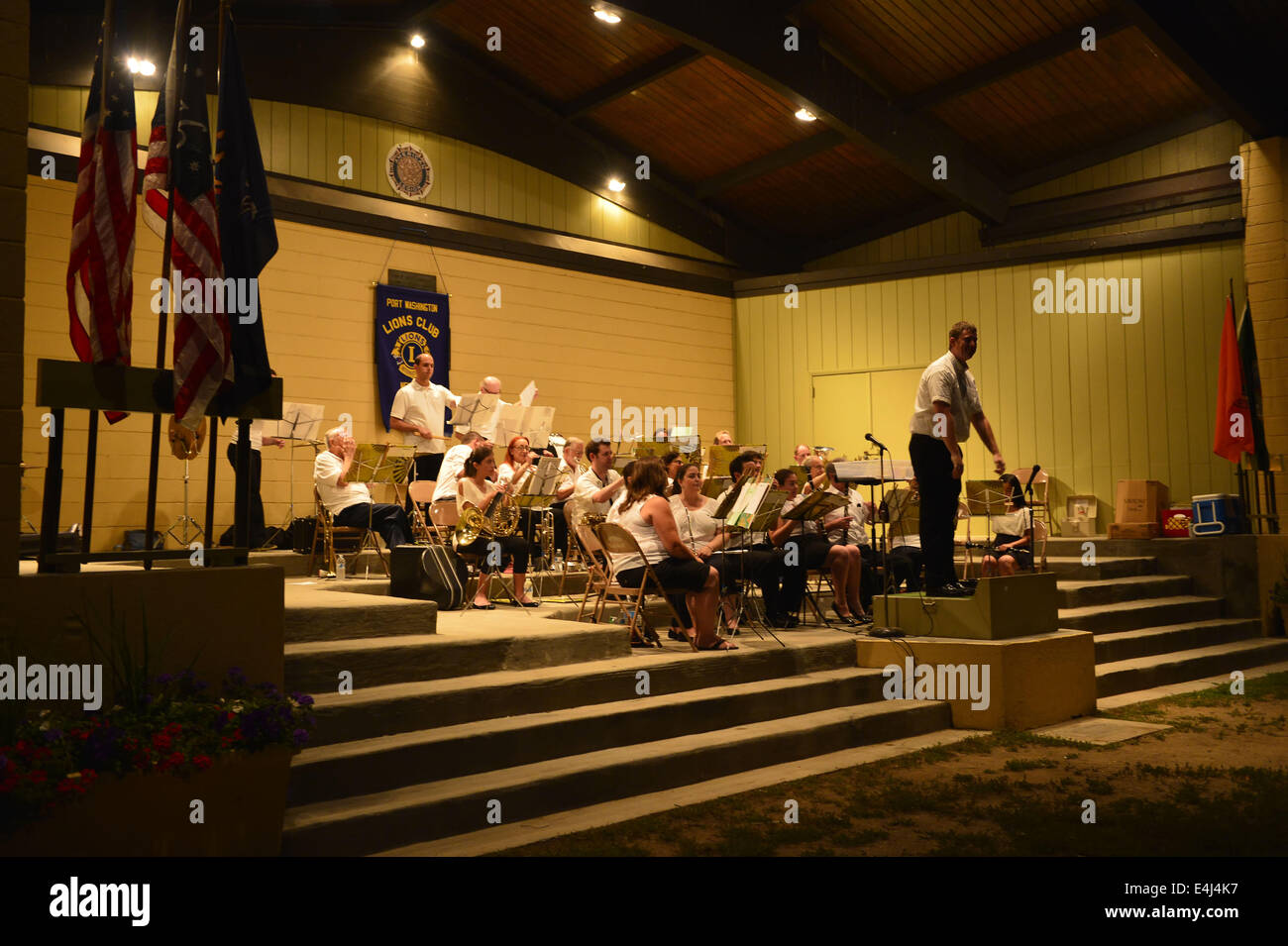 Port Washington, New York, USA. 11th July, 2014. Band conductor takes ...