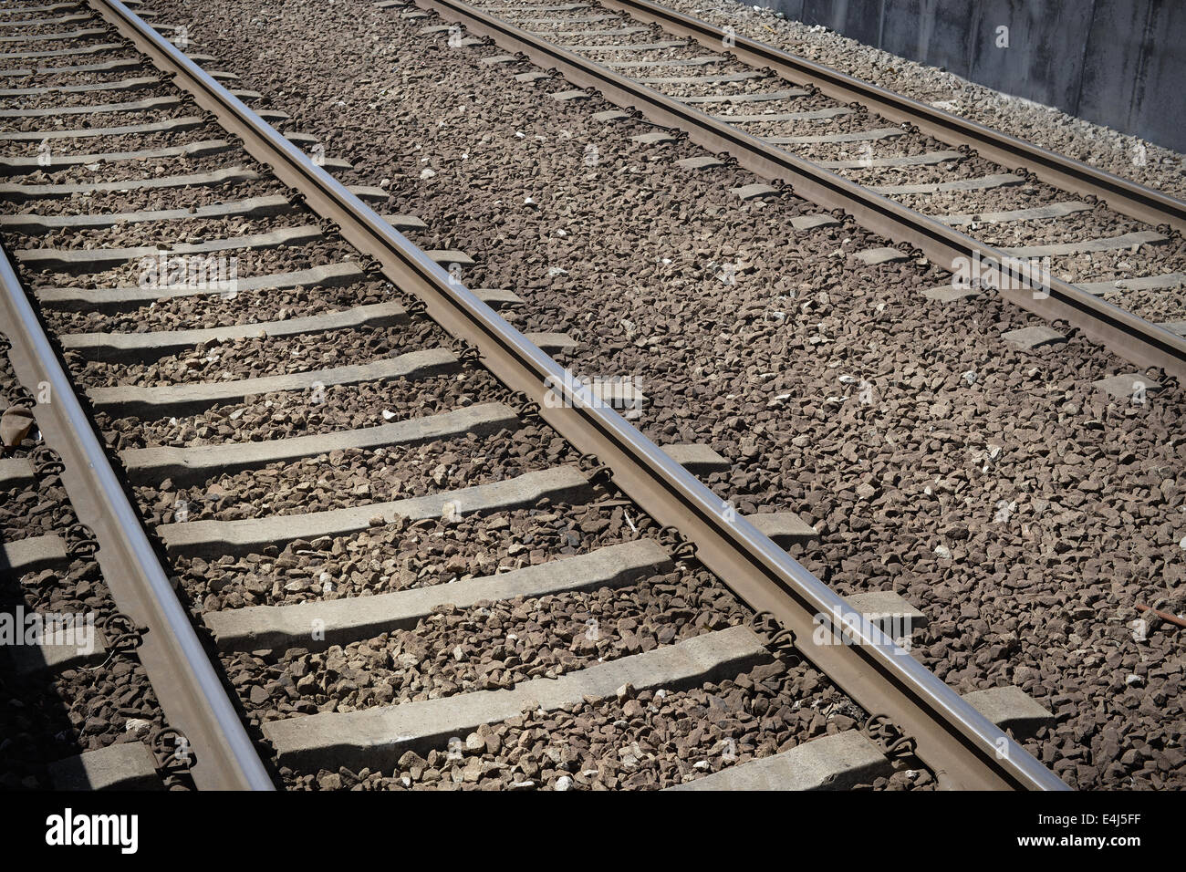 Closeup of railroad tracks on gravel Stock Photo - Alamy