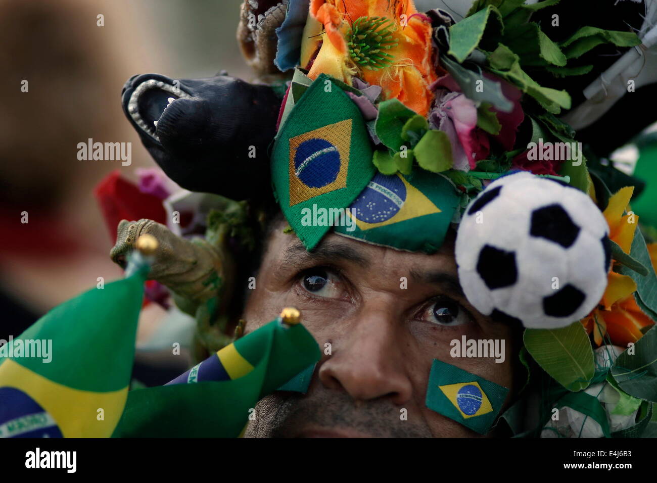 Rio De Janeiro, Brazil. 12th July, 2014. A brazillian fan reacts while ...