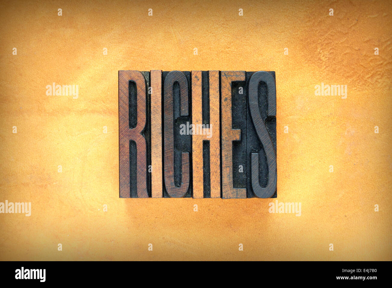 The word RICHES written in vintage letterpress type Stock Photo - Alamy