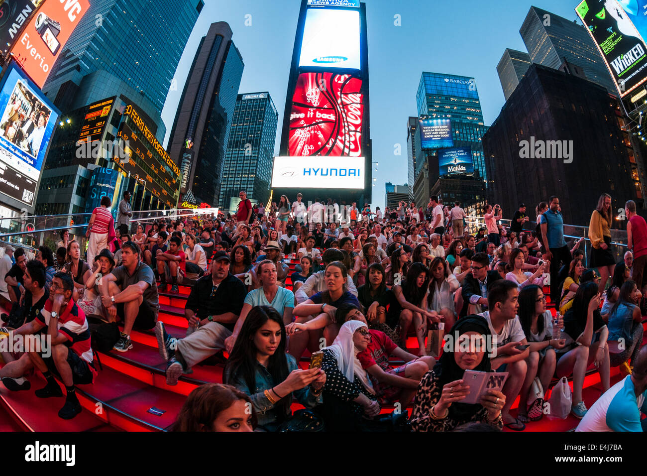 New York, NY - 11 July 2014 Tourists on the red TKTS Steps in Times ...