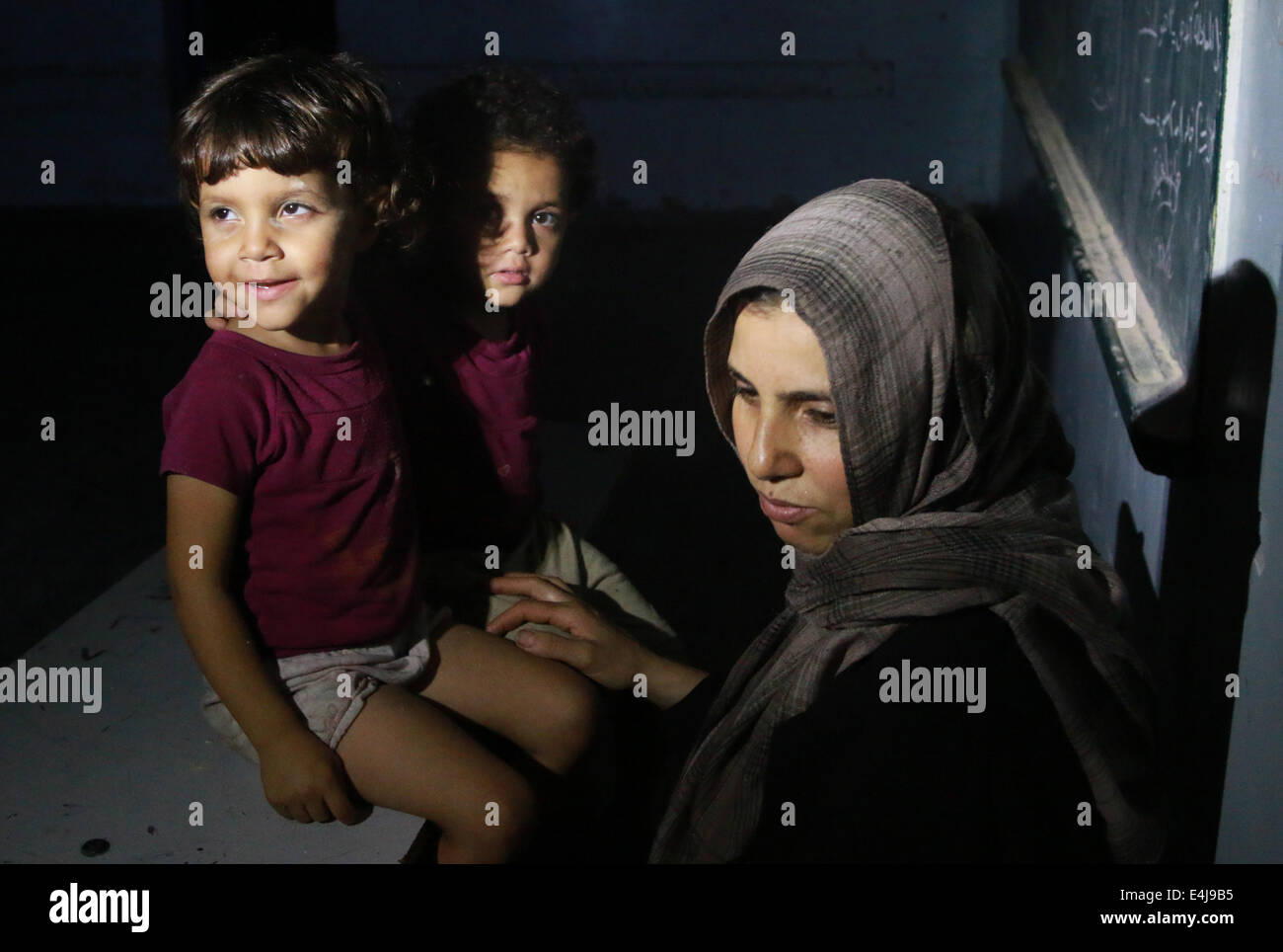Gaza. 13th July, 2014. Children from Al-Atar family playing around ...