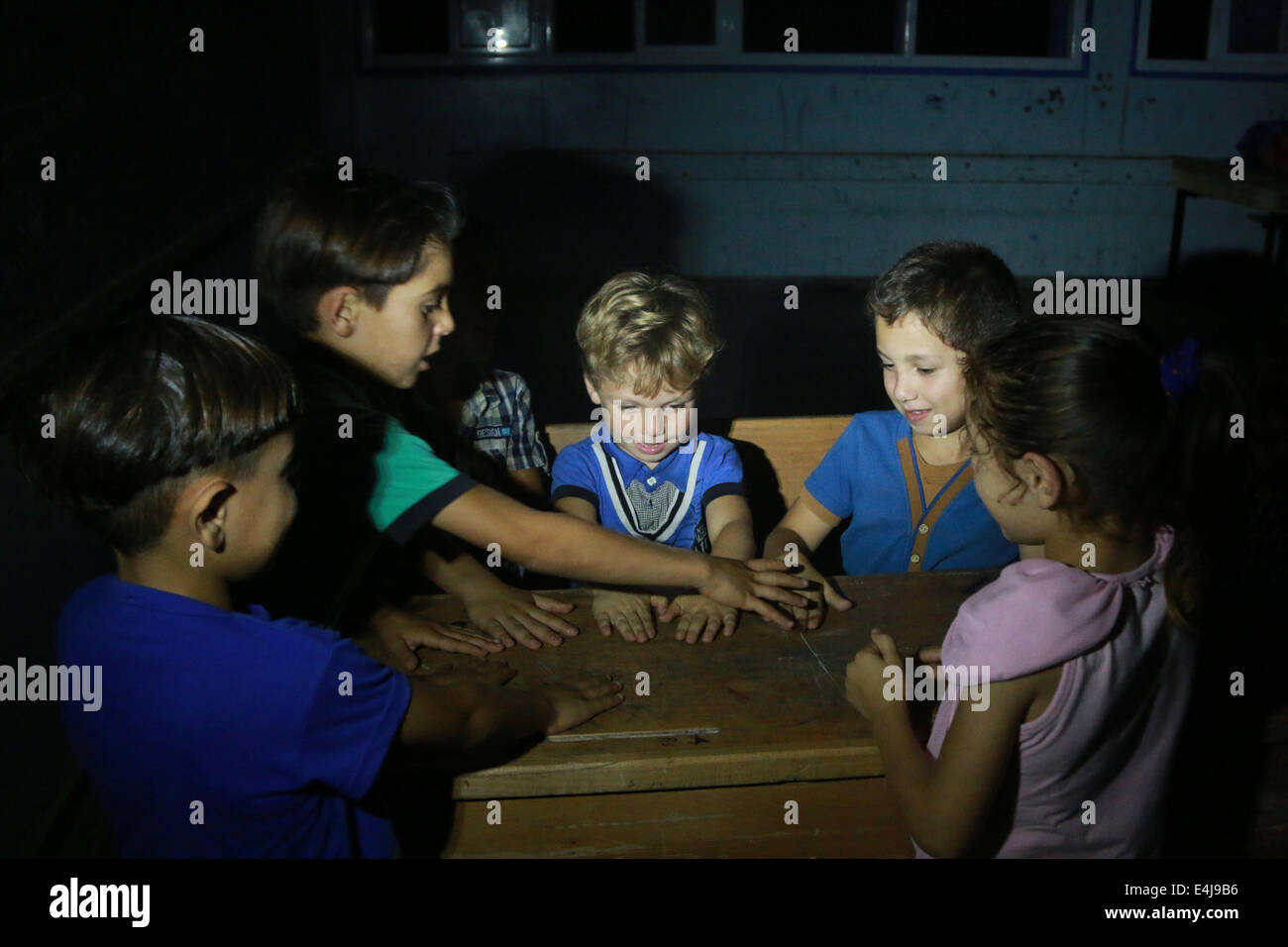 Gaza. 13th July, 2014. Children from Al-Atar family playing in a UN ...
