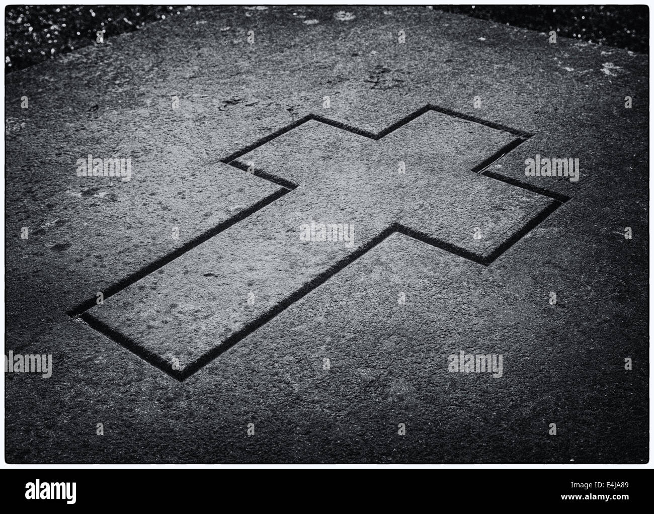 cross carved in a granite tombstone Stock Photo - Alamy