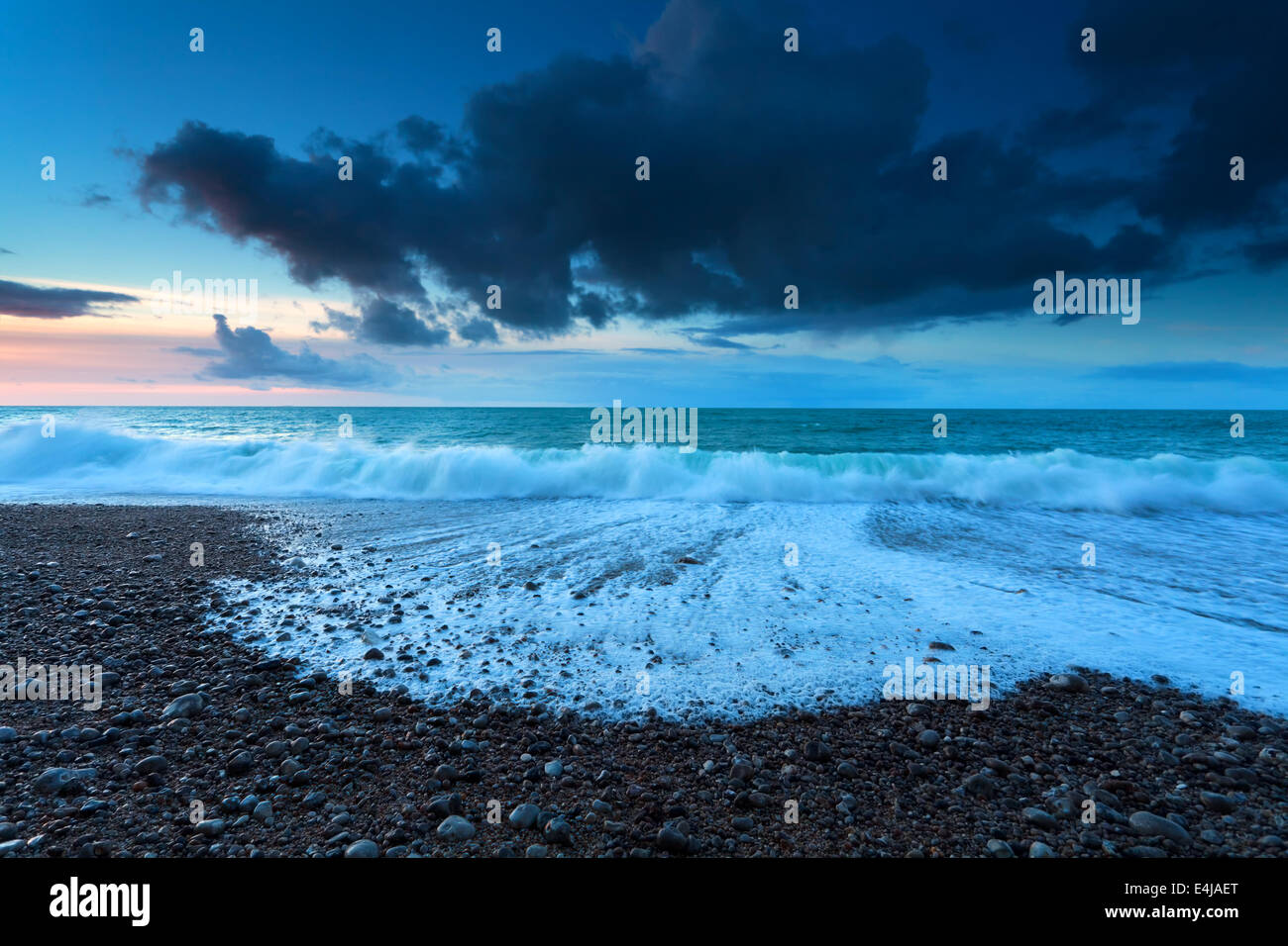 ocean waves in dusk, Normandy, France Stock Photo - Alamy