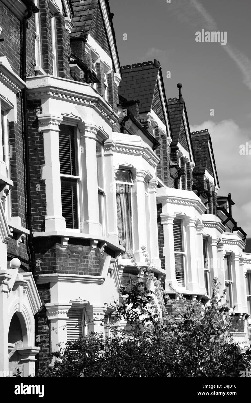 Black and white monochrome photograph of Victorian terraced town houses ...
