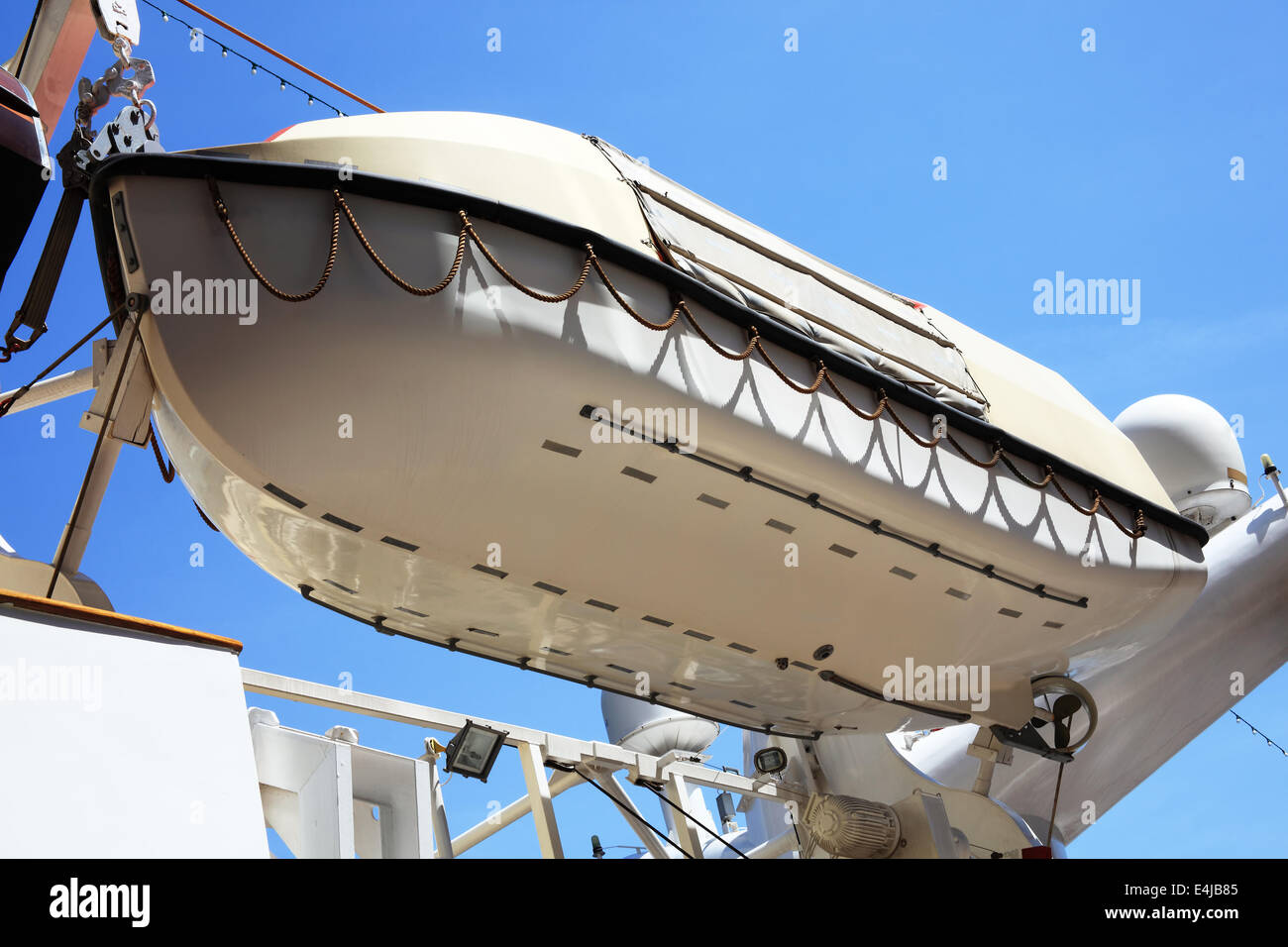 Modern lifeboat hanging on a cruise liner Stock Photo - Alamy