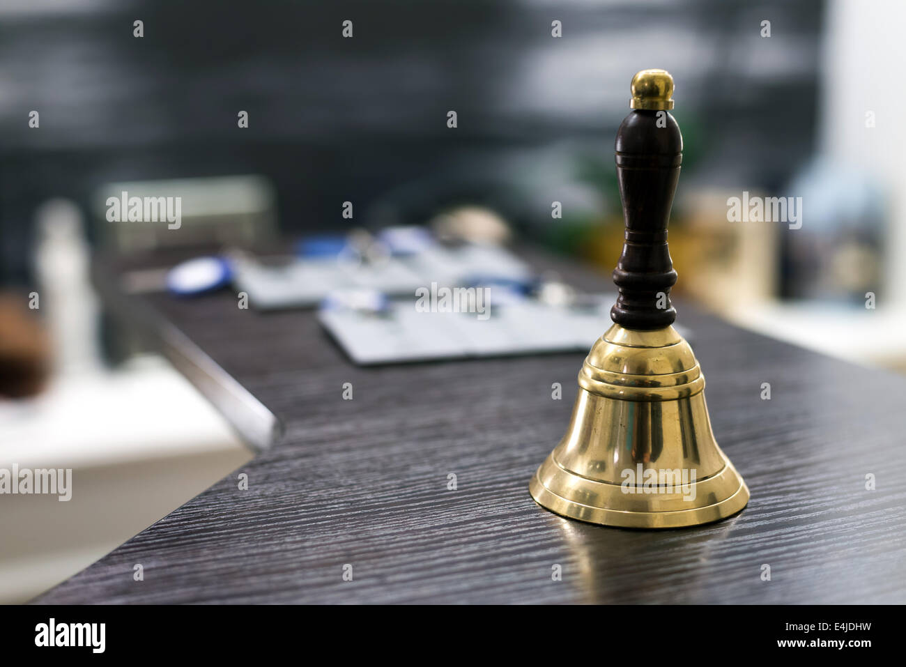 Bell on reception desk Stock Photo - Alamy