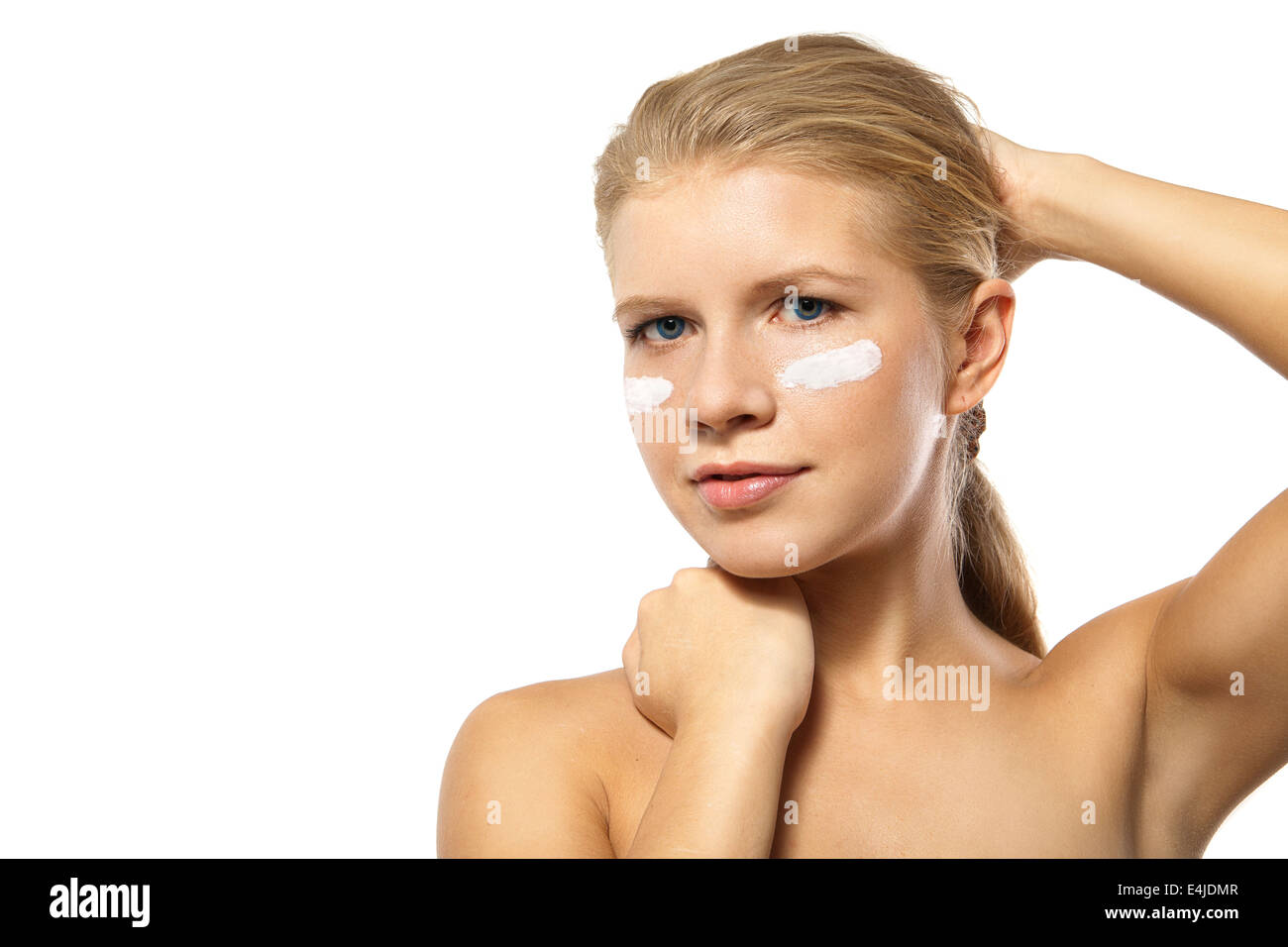 Portrait Of Young Woman Applying Moisturizer Cream On Clean Fresh Face