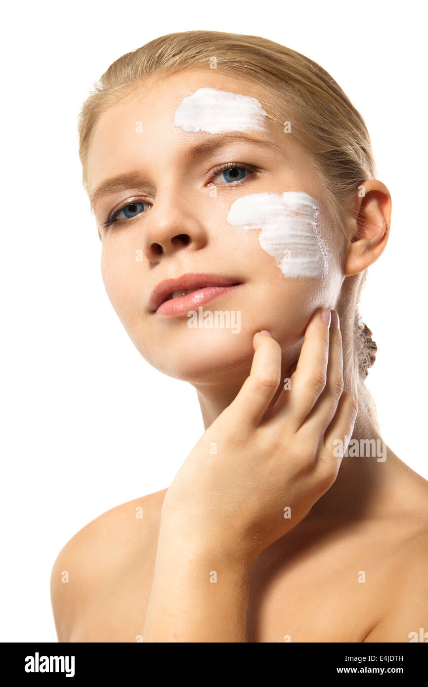 Portrait Of Young Woman Applying Moisturizer Cream On Clean Fresh Face