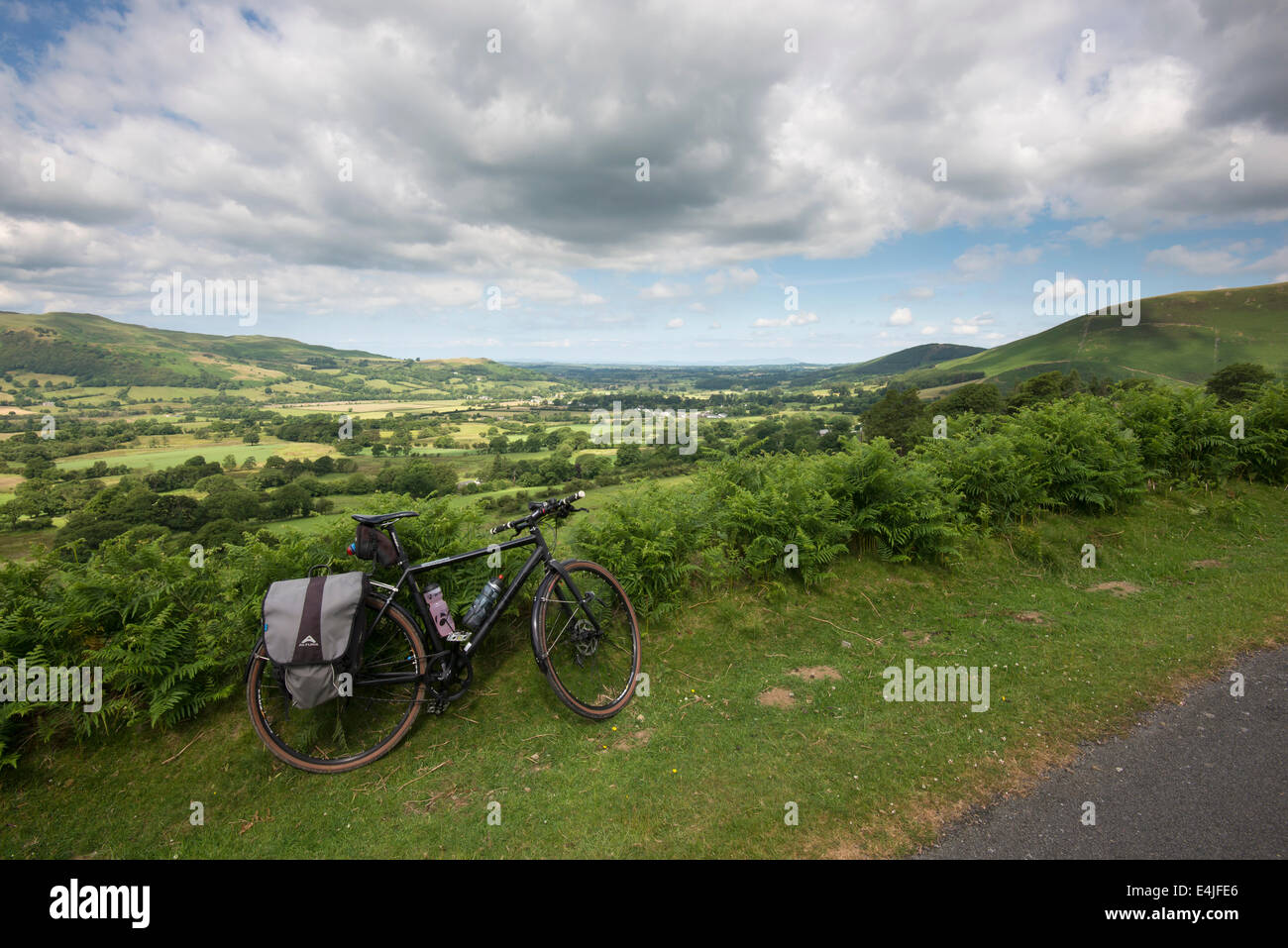 A bicycle, on the side of the "gated road" of Whinlatter Pass, in front ...