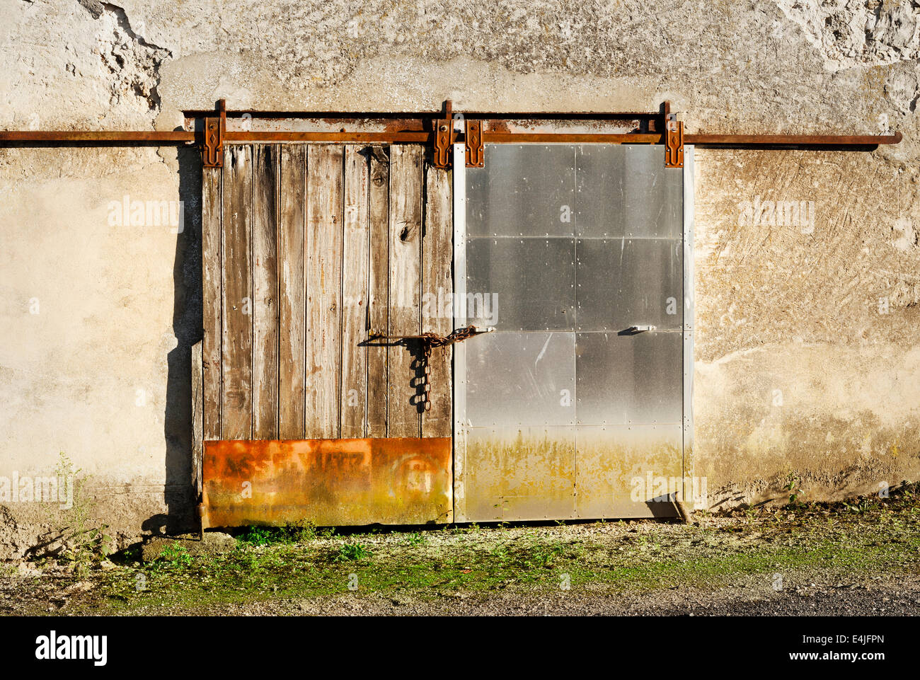 Weathered building door Stock Photo - Alamy
