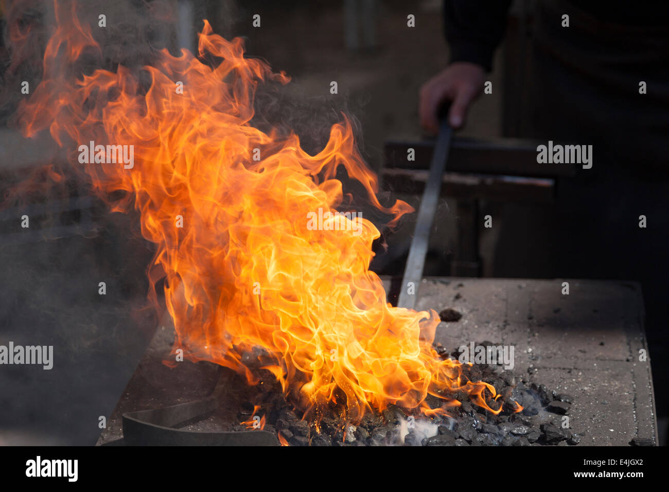 A blacksmith's coal forge Stock Photo - Alamy