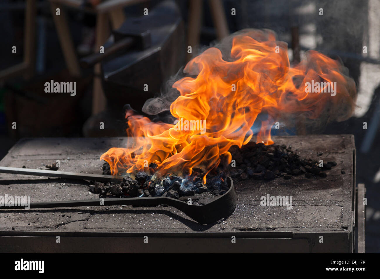 A blacksmith's coal forge Stock Photo - Alamy