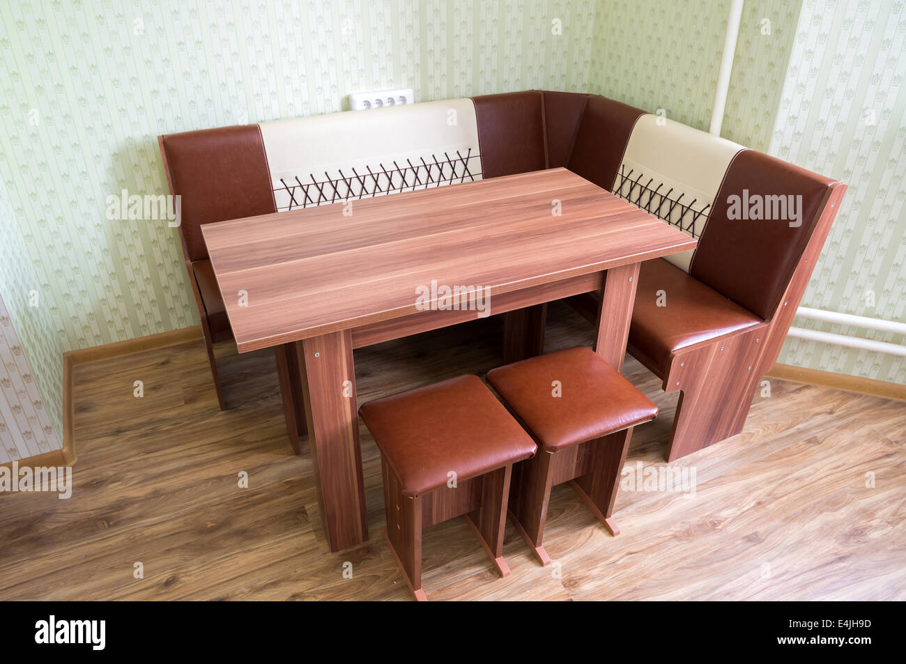 Kitchen angular sofa and table Stock Photo - Alamy