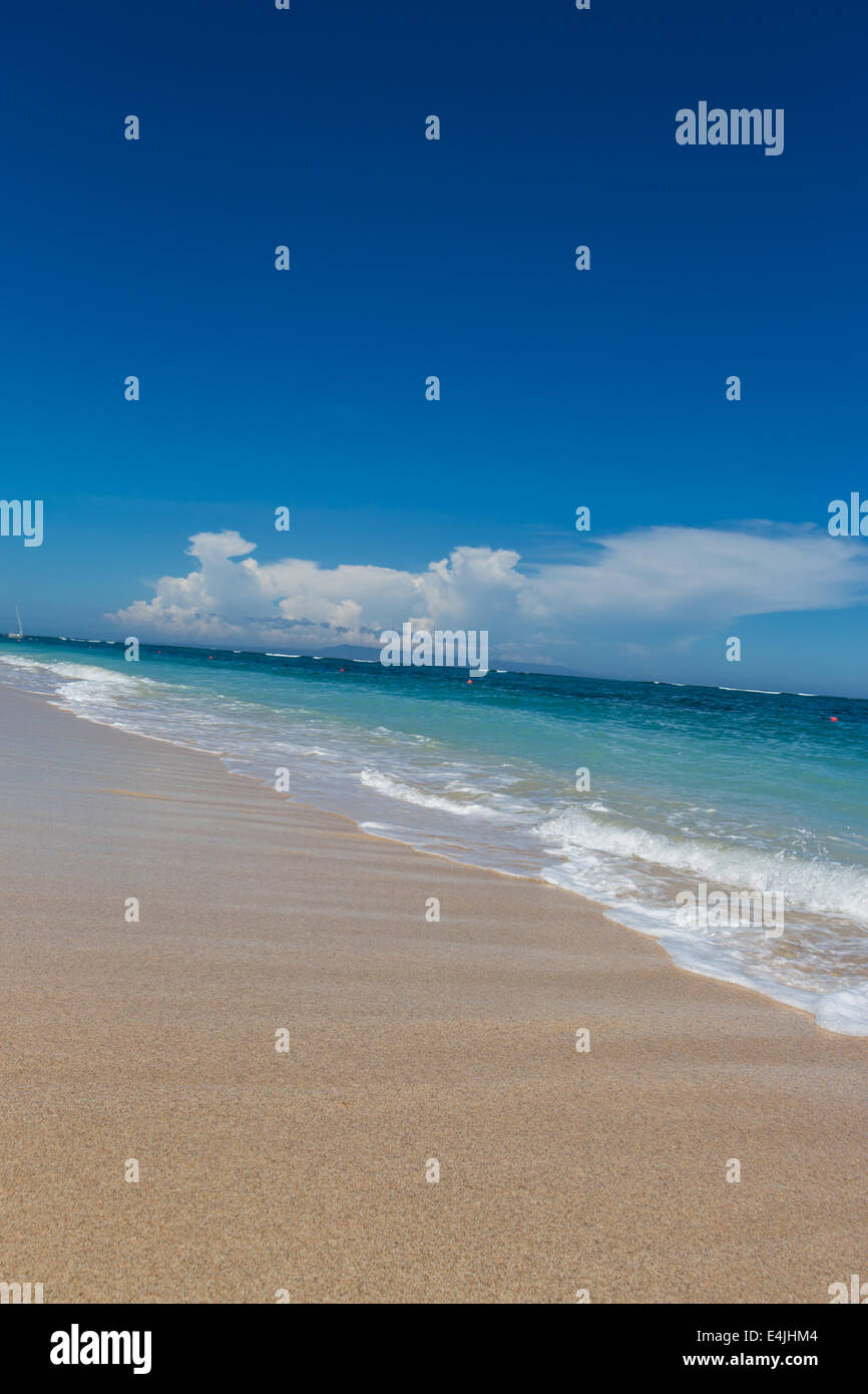 Beautiful tropical beach with lush vegetation fringing golden sand and ...
