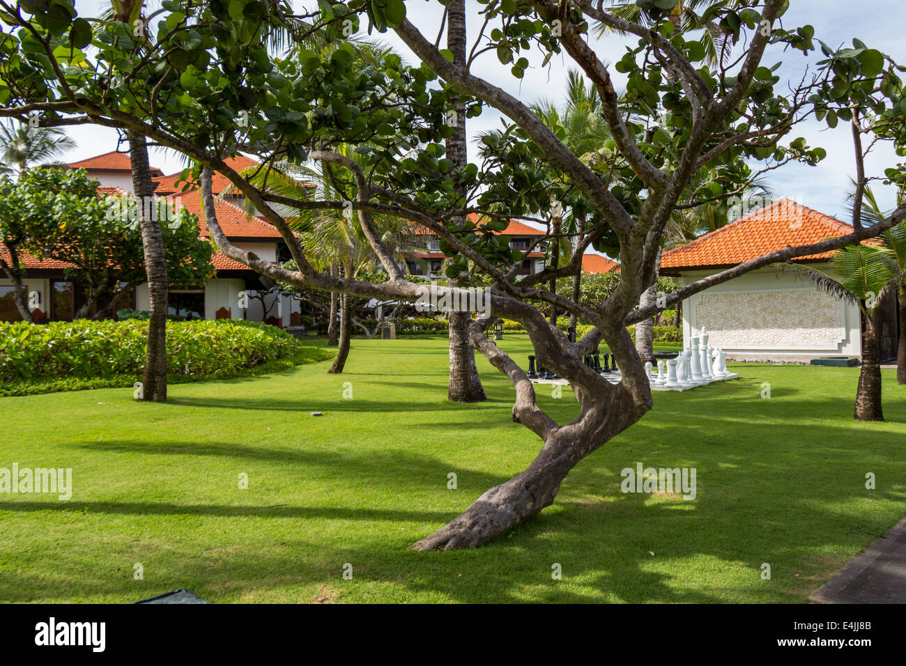 Ornate intricately carved and decorated stone column in formal Balinese ...