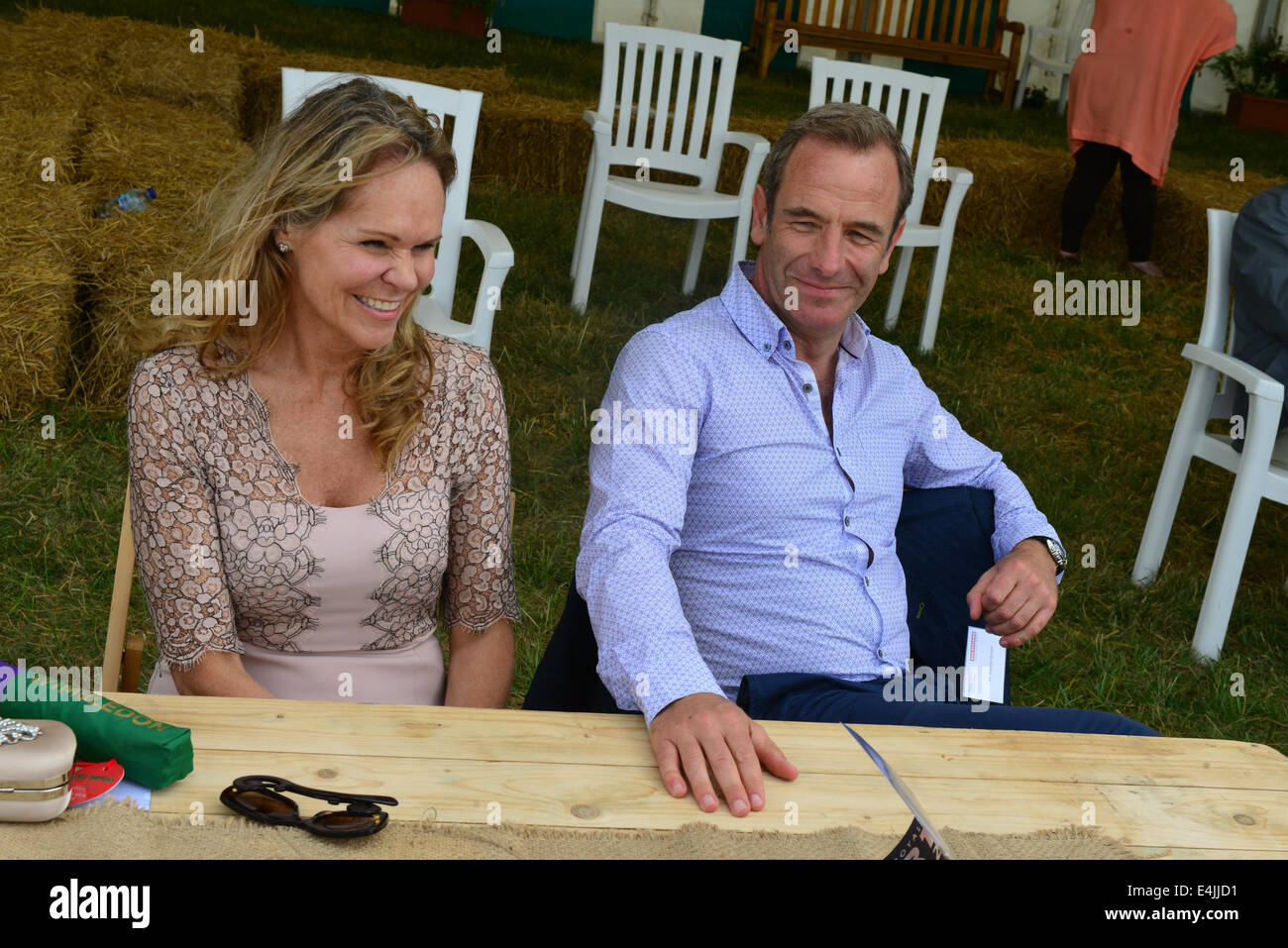 Fairford, UK. 13th July, 2014. Robson Green and Partner at the ...