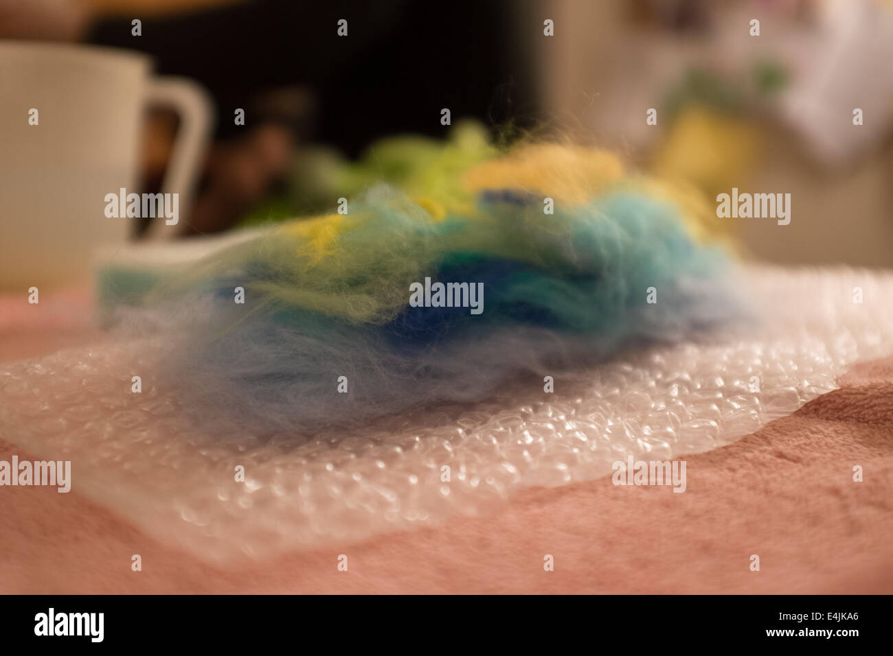 Detail of fibres laid out during felt making using bubble wrap Stock ...